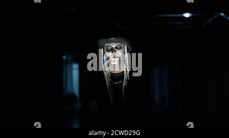 Frightening man in carnival skull Halloween makeup of skeleton looking ...