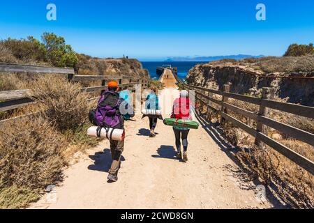 Hikers at the Beechers Bay pier, Santa Rosa Island, Channel Islands ...