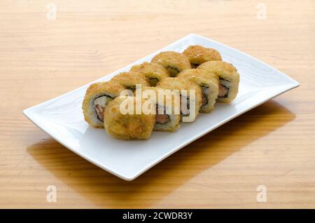 Tempura Maki Sushi Deep Fried Sushi Roll Served on wooden board Stock ...