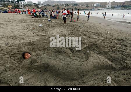 Woman-buried-in-sand-on-beach 83053 Stock Photo - Alamy