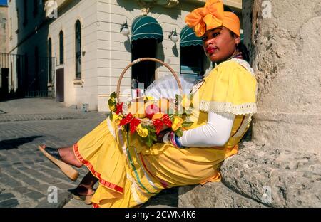 Cuban woman wearing traditional costume in the Plaza de la Catedral ...