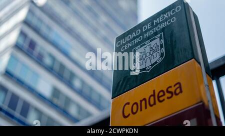 A Condesa Neighborhood Sign With the Latinamerican Tower in the Back ...
