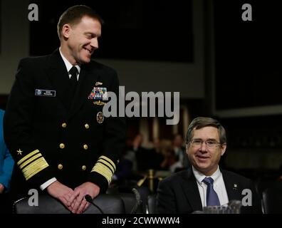 U.S. Navy Commander Kirk S. Lippold poses for photographs after the ...