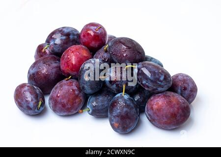 Fresh moyer purple plums isolated on a white background Stock Photo - Alamy