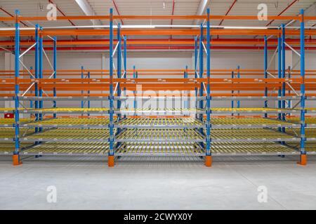 Gravity Flow Rack Shelving in Distribution Warehouse Stock Photo - Alamy