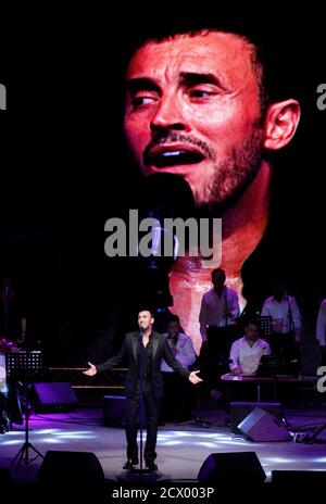 Iraqi singer Kazem al-Saher, front, performs in front of around 400 ...
