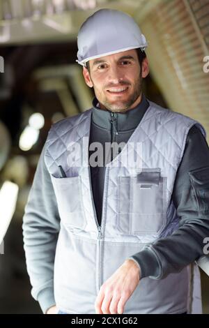 laborer posing and smiling Stock Photo - Alamy