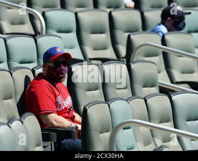 Baseball fans sit in social distance squares during a spring training ...