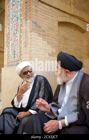 Islamic theologians in conversation. Mullahs at a madrassa, Shiraz ...