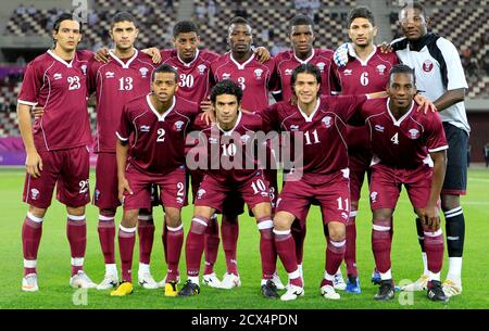 Players of Qatar national team pose for a photo before the Asian ...