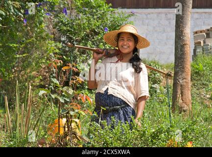 Woman transporting water in buckets to her home. Kalaw. Burma. Myanmar ...
