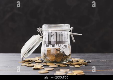 401k savings jar on a dark background Stock Photo - Alamy