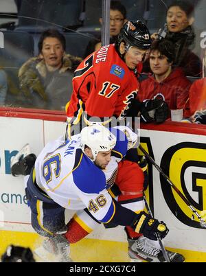 St. Louis Blues' Roman Polak, foreground, collides with Minnesota Wild ...