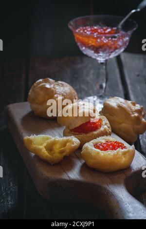 Tasty Stuffed pastry over wooden background Stock Photo - Alamy