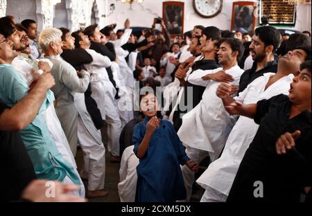 Shia Muslims beat their chests during a religious procession on the 5th ...