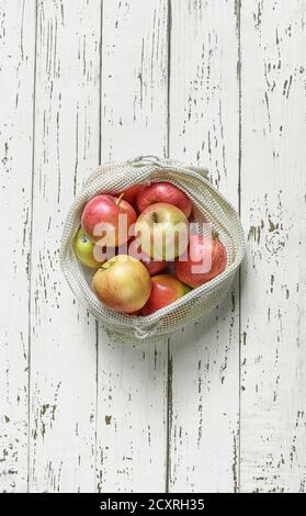 apples in an environmentally friendly bag, Eco friendly bag with red ...