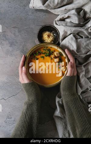 Female hands with bowl of pumpkin soup Stock Photo - Alamy
