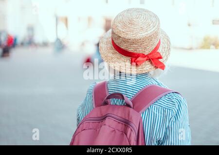 Traveler girl with a backpack traveling to the train station. Travel ...