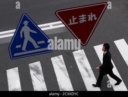 Japanese stop sign on the road, Tomare Stock Photo - Alamy