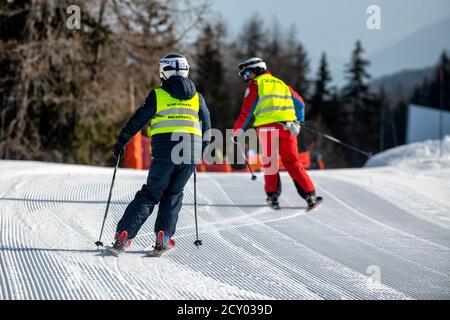 A blind skier follows a guide in the French alpine ski resort of La ...