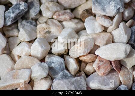 Raw rocks and minerals as natural stones background with crushed and ...