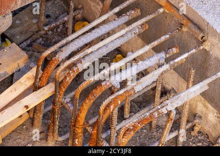 Rusty steel threaded rods bars with yellow protection caps. Covers ...