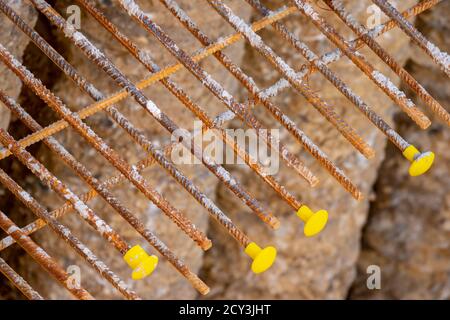 rebar caps on rebar at construction site for safety Stock Photo - Alamy
