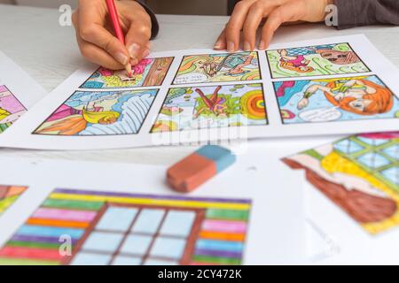 An animator painter draws a color storyboard for a comic book or movie ...