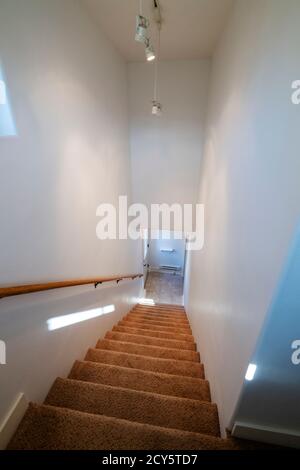 Empty residential stair well Stock Photo - Alamy