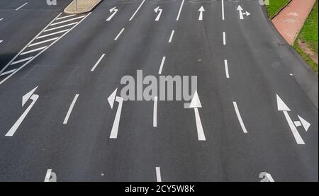 Road markings, turning lanes, directional signs at a crossing, turning ...