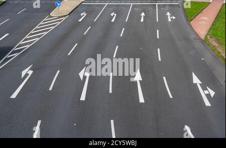 Road markings, turning lanes, directional signs at a crossing, turning ...