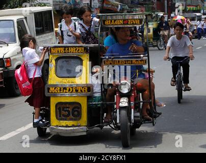 Overloaded Tricycle in Manila, Philippines Stock Photo - Alamy
