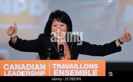 Jack Layton's wife Olivia Chow receives a feather from Shawn Atleo after he gave an Aboriginal ...