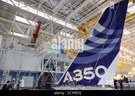 The first wing of the new long-range jet airliner Airbus A350-900 is ...