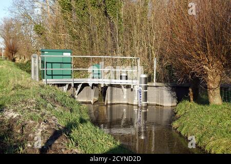 Very small Dutch weir (Dutch: klepstuw) in a ditch. The weir regulates ...