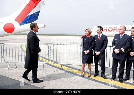 Crew members of the airline Air France KLM walk past the airbus A380 on ...