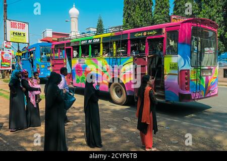 Busy, colourful bus stop and mosque in the centre of this important ...