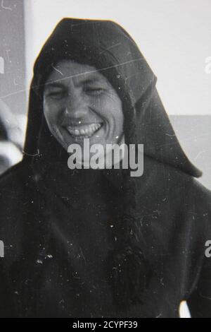 Catholic Nun wearing traditional habit clothing walking along the ...