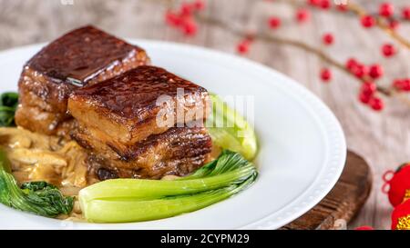 Dong Po Rou (Dongpo pork meat) in a beautiful blue plate with green ...