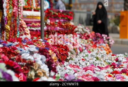 A woman looks at a flower stall in Rundle Mall Adelaide, Australia ...