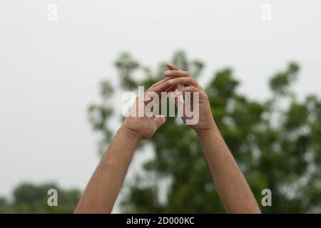 male hand gesture and signs on outdoor background Stock Photo - Alamy