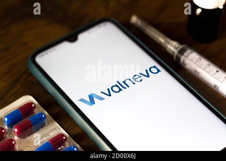 In this photo illustration the Valneva SE logo seen displayed on a ...