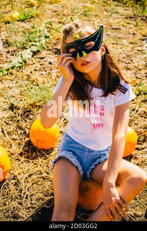 Teenager caucasian girl wearing fashion yellow sunglasses screaming ...