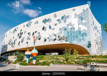 Exterior of the New Calgary Central Library. The exterior is a textured ...