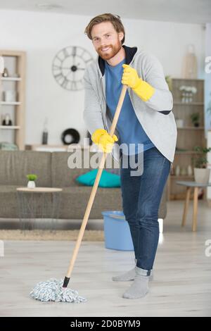 young man mopping floor Stock Photo - Alamy