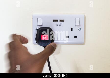 Pull the plug concept of a Man's hand pulling out the plug from a ...