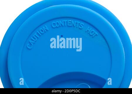 Caution contents hot - detail on lid of ceramic reusable drinks cup ...