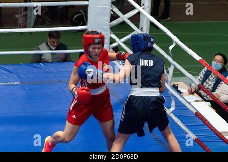 KHARKIV, UKRAINE - OCTOBER 2, 2020: Girls boxers in the fight on the ...