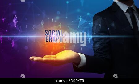 Elegant hand holding SOCIAL GRAPH inscription, social networking ...