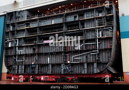 Workers at BAE Systems Govan Shipyard in Glasgow leave via the front ...